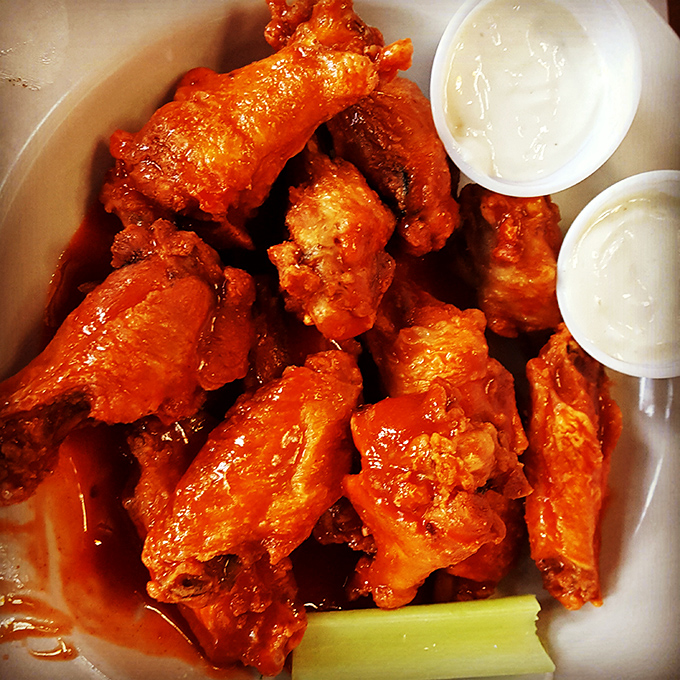 Wings so saucy they should come with their own shower station. These aren't first-date food unless you're testing their sense of humor.
