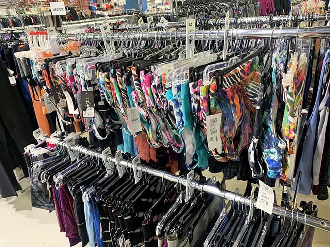 A kaleidoscope of activewear hangs in perfect formation—workout motivation in fabric form at prices that won't make your wallet sweat.