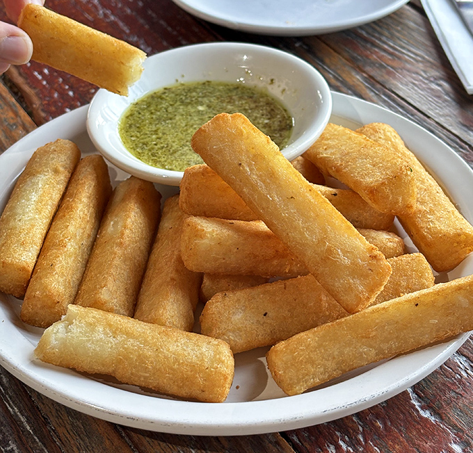 Yuca frites&mdash;crispy on the outside, pillowy within&mdash;are what French fries dream of becoming when they grow up. That dipping sauce seals the deal.