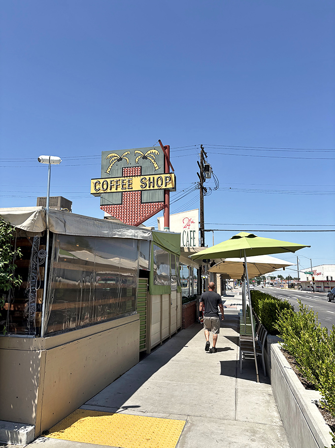 That vintage neon tower stands tall like a breakfast lighthouse, guiding hungry souls to morning perfection.