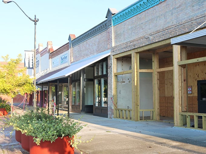 Colorful awnings and brick facades give DeFuniak Springs' shopping district a timeless appeal that big malls can't match.