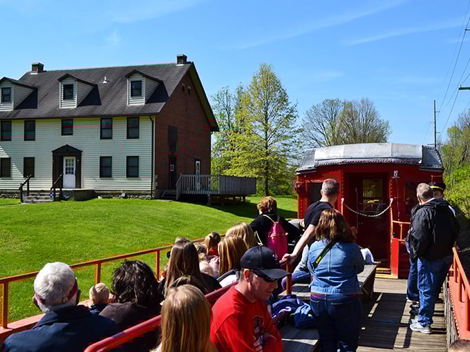 Passengers enjoy the open-air car experience, where the countryside unfolds around you and the gentle rocking motion lulls you into railroad-induced relaxation.