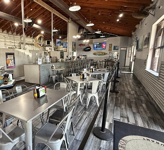Industrial-chic meets fishing village aesthetic &ndash; metal chairs, wooden floors, and nautical touches create the perfect seafood backdrop.