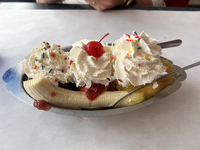 The banana split—dessert's answer to the three-act play. Fresh banana, multiple ice cream flavors, and whipped cream performing in perfect harmony.