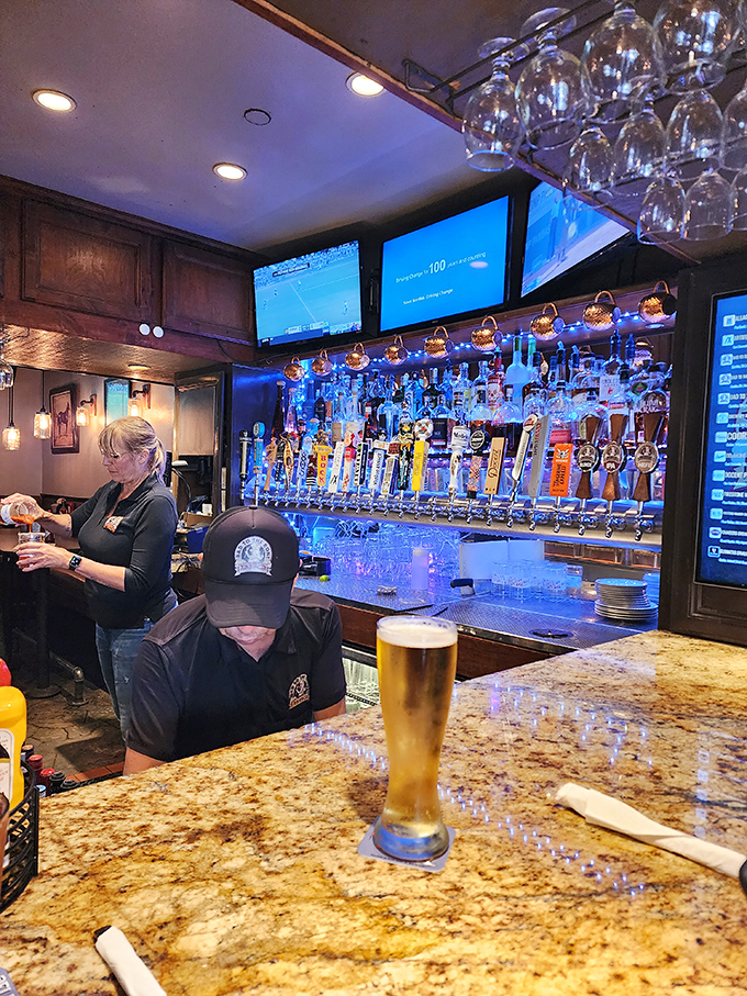 The bar's impressive tap selection stands ready for duty. Those beer glasses aren't just vessels&mdash;they're chalices of refreshment for parched barbecue lovers.