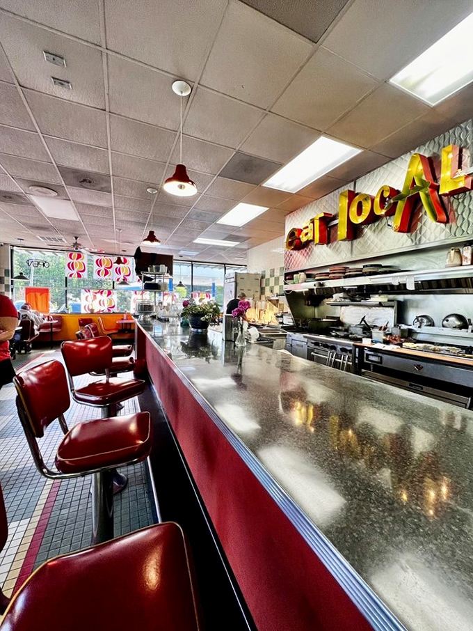 Counter seating that offers dinner and a show. Those red vinyl stools have probably witnessed more food epiphanies than a cooking competition judge.