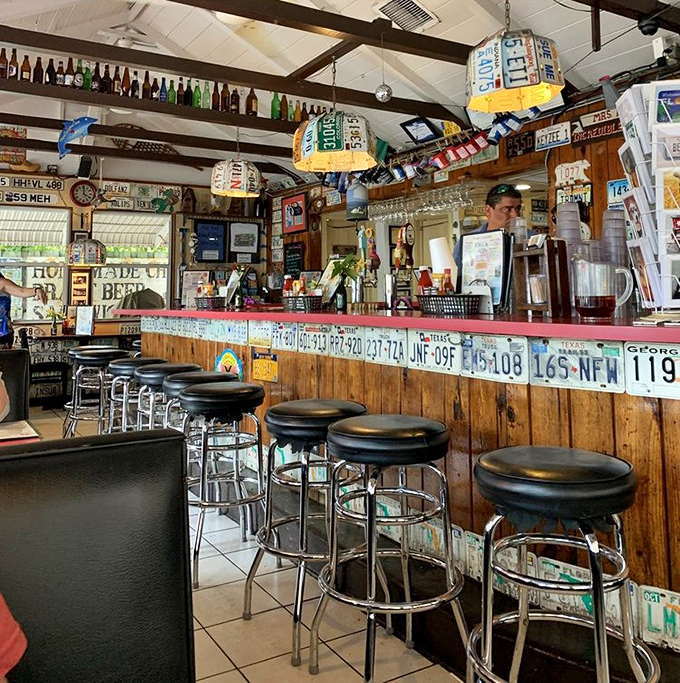 The bar area feels like your favorite uncle's Florida room—if your uncle collected license plates and served really good drinks.