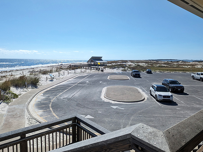 The parking lot might be paved, but paradise awaits just steps away—where asphalt gives way to sugar-white sand and endless horizon.