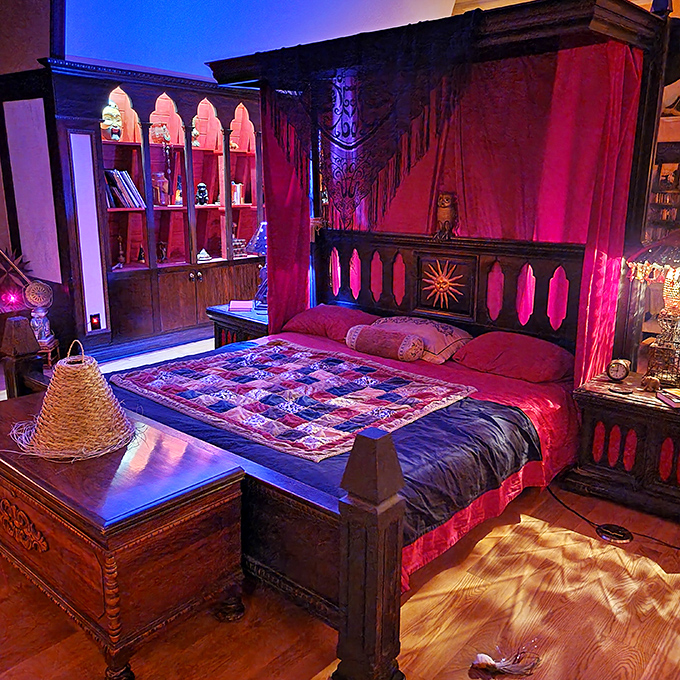 The four-poster bed draped in sumptuous fabrics creates a sleeping chamber that would make even Dracula consider redecorating his castle.