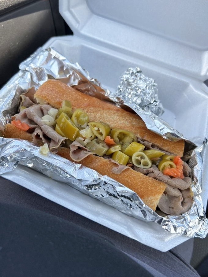 The Italian beef in its natural habitat—wrapped in foil, swimming in jus, ready to transport you straight to Wrigley Field.