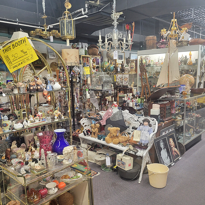 Organized chaos at its finest! This vendor booth is where porcelain dolls, cobalt glass, and childhood memories collide in a magnificent treasure avalanche. Marie Kondo would have a panic attack.