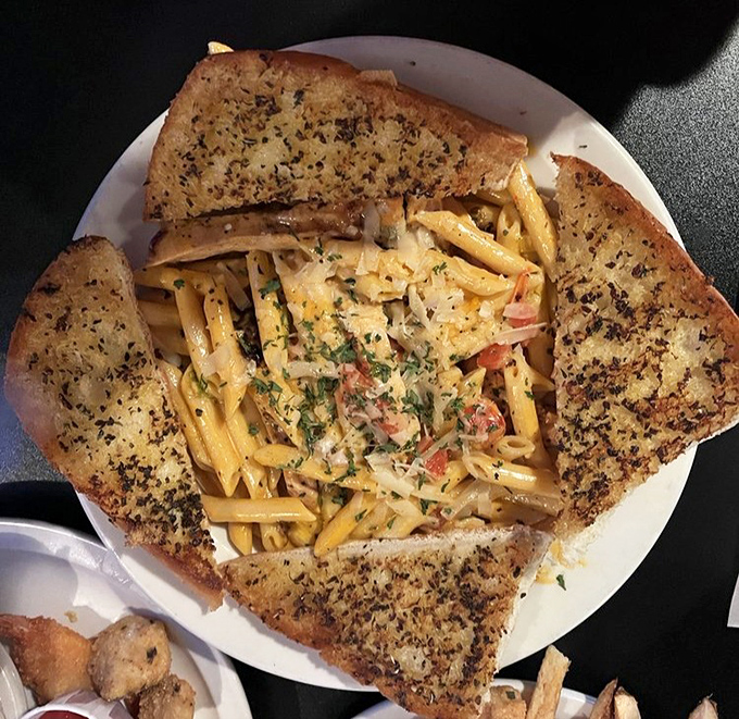 Pasta that doesn't just sit on the plate but tells a story &ndash; each piece of garlic bread ready to soak up sauce too good to leave behind.