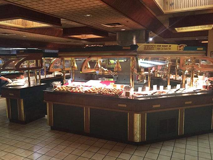 The buffet's grand central station where decisions are made, plates are filled, and diet plans are temporarily suspended in the name of culinary exploration.