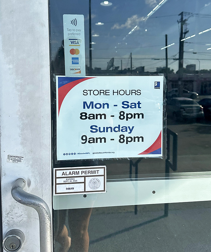 The store hours sign: a crucial piece of information for planning your thrifting strategy. Early birds get the vintage worms.