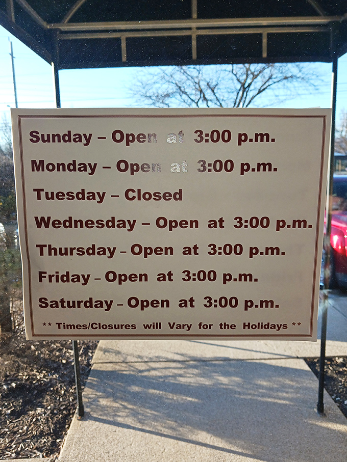 Business hours posted with clarity – the restaurant equivalent of "Here's when we'll be ready to hug you with food."