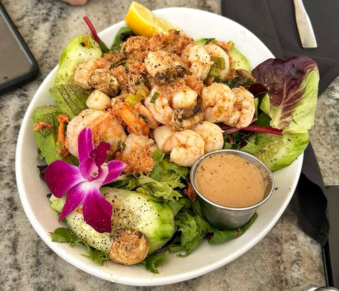 This seafood salad comes with its own tropical flower, because when shrimp looks this good, it deserves its own lei.