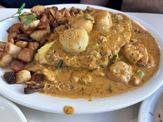 The Cajun seafood omelet with home fries&mdash;where breakfast meets New Orleans in a flavor collaboration that deserves its own jazz soundtrack.