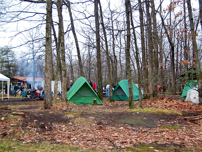 Camping among the trees near Laurel Caverns adds another dimension to the adventure. These simple green tents promise stargazing after a day of cave exploration.