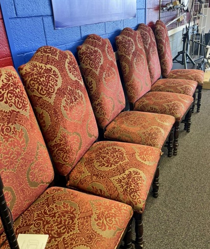 These ornate dining chairs with their regal red upholstery once hosted fancy dinner parties. Now they're waiting for your Thanksgiving table at a fraction of the cost.