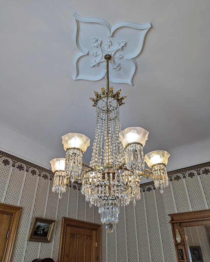 Crystal chandeliers that have illuminated conversations across three centuries. Imagine the secrets those sparkling prisms have witnessed since the Civil War era!