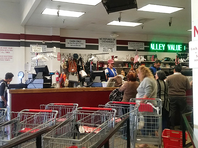 At checkout, shopping carts filled with discoveries wait their turn while cashiers process treasures with assembly-line efficiency.