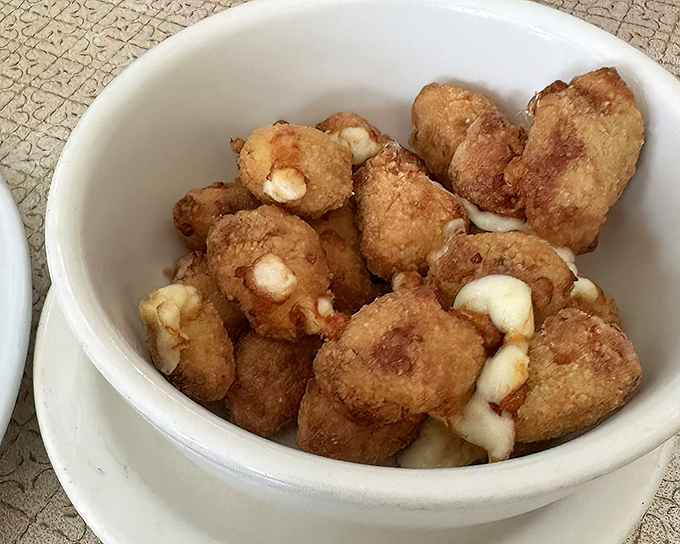 Wisconsin's beloved cheese curds, golden-fried to perfection&mdash;little nuggets of joy that squeak their approval with every delicious bite.