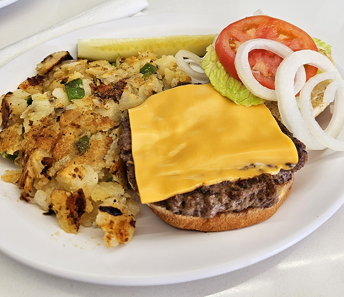 A cheeseburger that understands its purpose in life: to be straightforward, satisfying, and accompanied by those addictive home fries.