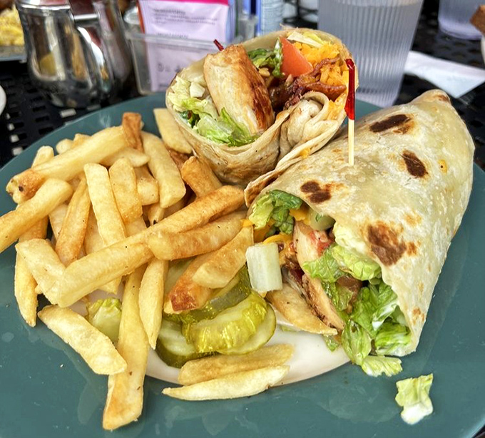 This wrap isn't just holding ingredients&mdash;it's containing a flavor explosion, served with fries that are clearly on a first-name basis with the fryer.