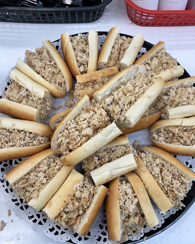 A platter of mini cheesesteaks arranged like the spokes of a delicious wheel. Sandwich geometry at its most appealing.