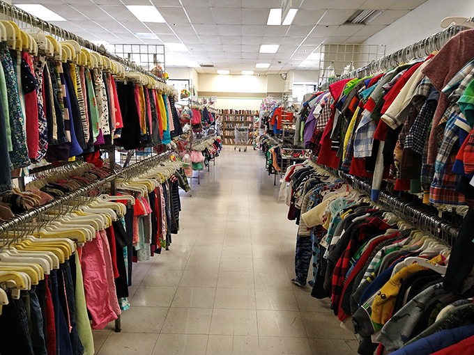 The clothing aisles stretch toward retail infinity. Like the wardrobe to Narnia, except everything leads to compliments on your thrifty style.