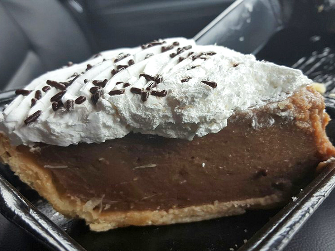 Chocolate cream pie with a cloud of whipped topping&mdash;the kind of dessert that makes you seriously consider ordering a second slice.