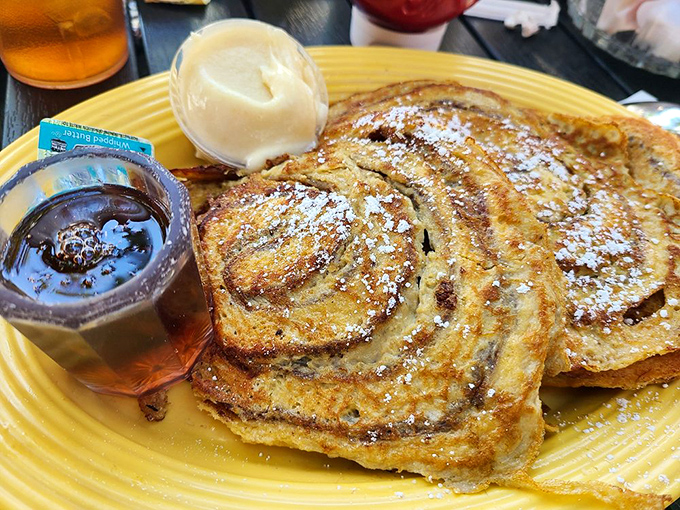 The Cinnamon Roll French Toast performs the culinary magic trick of transforming two breakfast favorites into something greater than their parts.