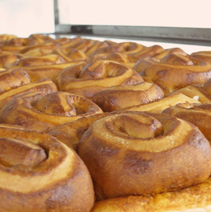 Cinnamon rolls so perfectly spiraled they could hypnotize you into happiness. The golden-brown swirls promise that everything, for this moment at least, is absolutely right with the world.