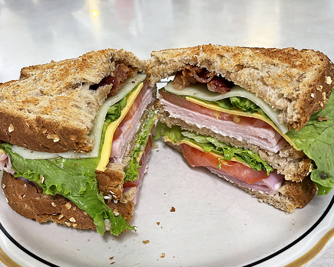 That club sandwich stands tall and proud, like a delicious skyscraper you get to demolish bite by bite.