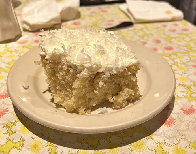 Coconut cake so light and fluffy it looks like it might float right off the plate if you don't anchor it with your fork.