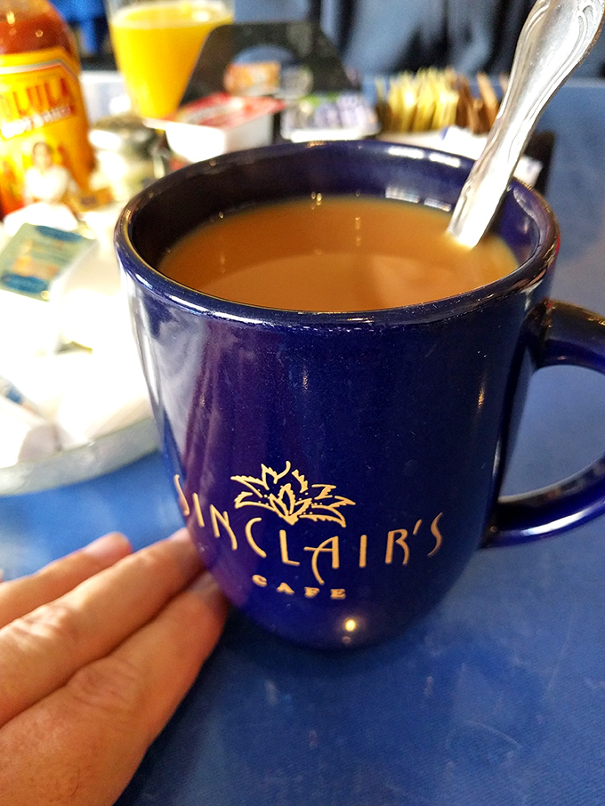 The signature blue mug&mdash;where coffee isn't just served, but presented as the liquid courage needed to face whatever Tuesday has planned for you.