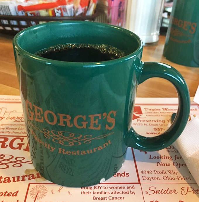 That signature green mug doesn't just hold coffee &ndash; it holds the fuel that powers half of Dayton through their morning meetings.