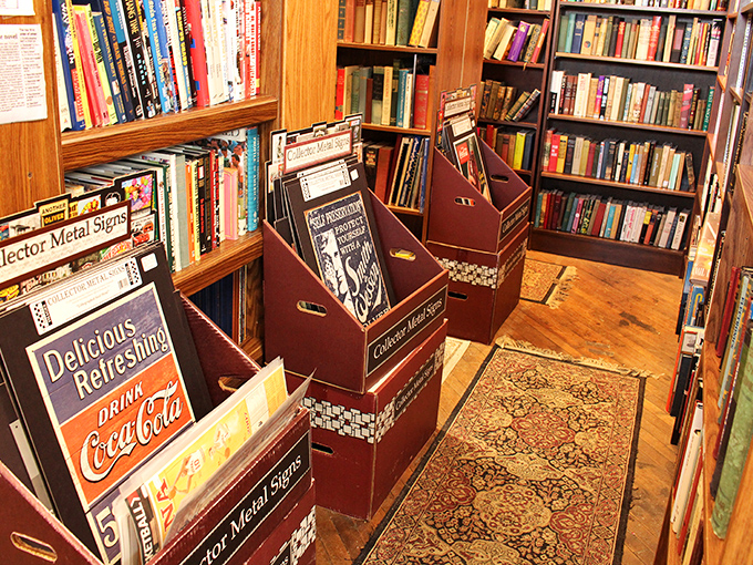 A literary treasure trove where vintage books and metal signs create the perfect corner for those who prefer their reading material with a patina of age.