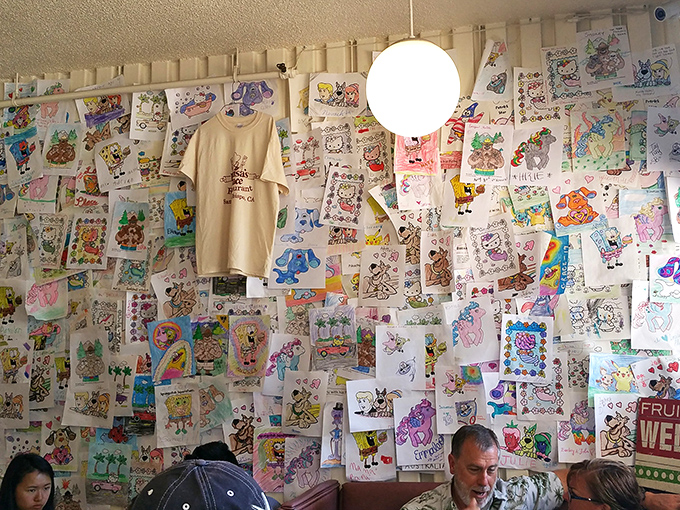 The wall of children's drawings isn't just decoration&mdash;it's a community art gallery where crayons and imagination create the most honest restaurant reviews.