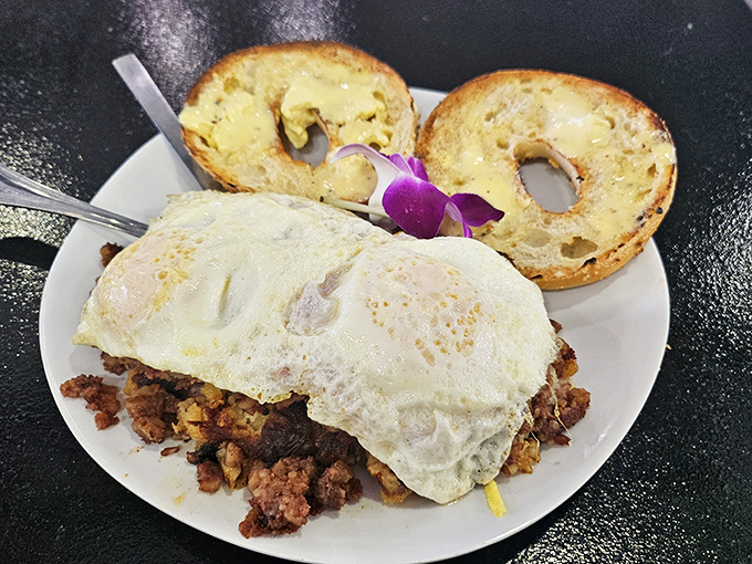 Corned beef hash topped with eggs alongside toasted bagels&mdash;a breakfast powerful enough to fuel you through any Florida adventure.