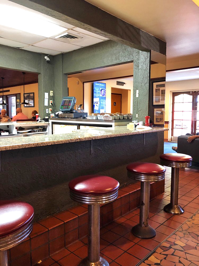 Classic counter seating where regulars have claimed their spots for years. This is where the real Lakeland gossip gets exchanged over coffee refills.