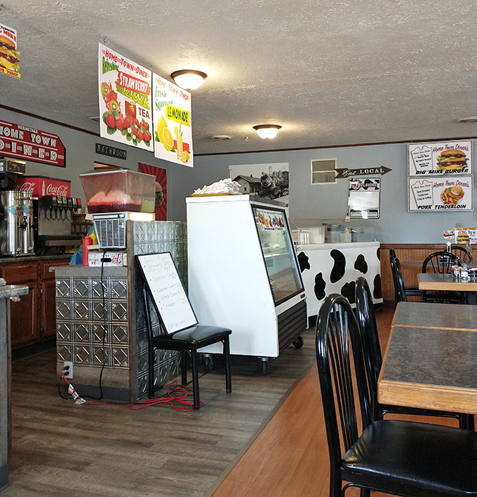 Vintage-style signage advertising strawberry and lemon pie hangs above the soda fountain, promising sweet rewards after your savory meal.