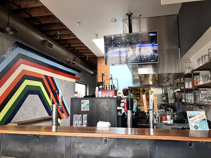 The counter where dreams come true, complete with rainbow wall art that matches the colorful flavor profiles.