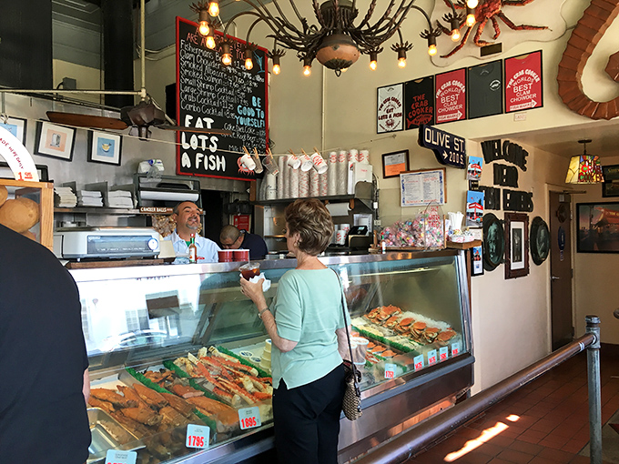 At the market counter, tomorrow's dinner waits behind glass like aquatic celebrities ready for their close-up.