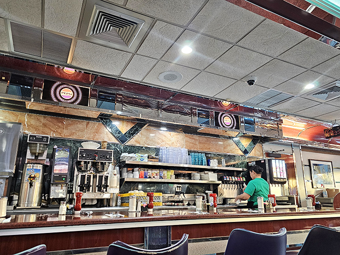 The counter&mdash;where solo diners find community, coffee achieves immortality through infinite refills, and breakfast is served with a side of banter.