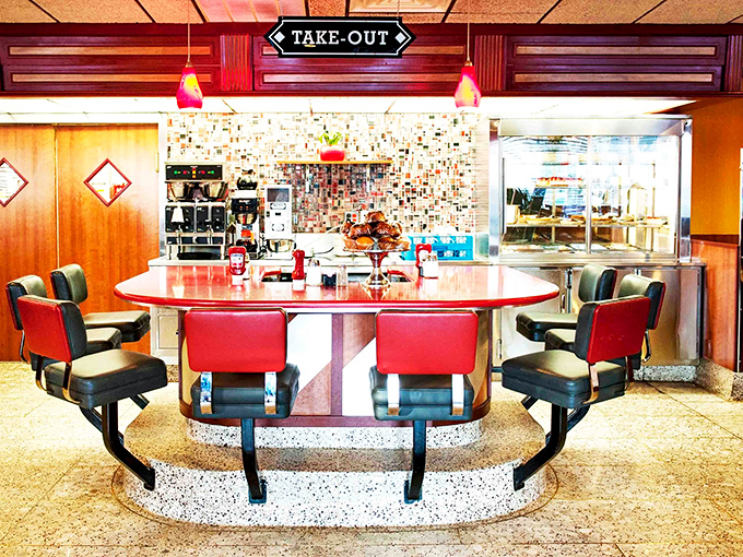 The counter island with its distinctive curved design &ndash; a diner's social hub where regulars claim their territory and newcomers become converts.