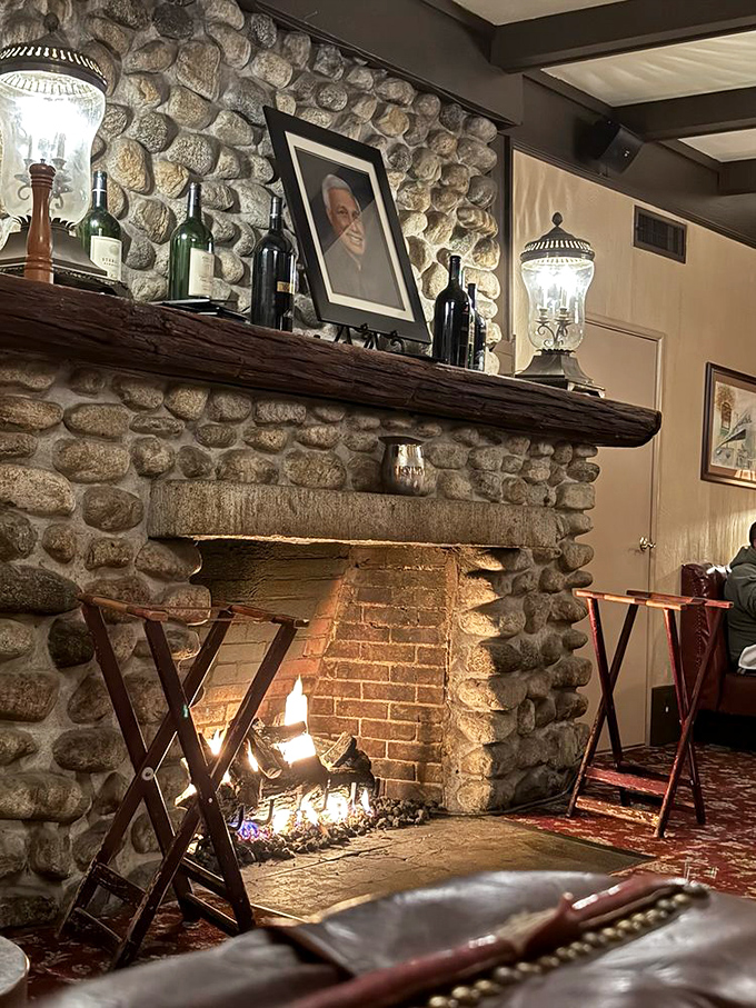 A stone fireplace crackles with warmth, the kind of cozy corner where you'll want to linger over coffee and one more story. 