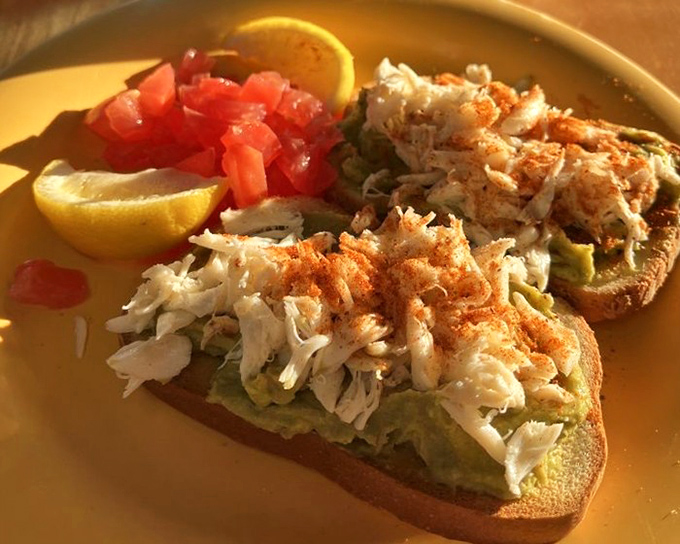 Avocado toast that's gone coastal – topped with delicate crab meat that makes this breakfast staple ready for its Florida beach vacation.