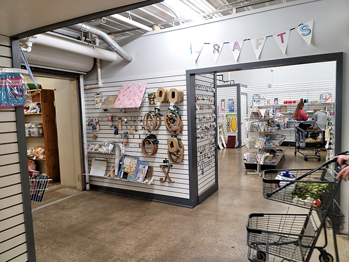 Craft supplies and home decor items line the walls in this creative corner. Pinterest projects become much more affordable when you're starting with thrift store prices.