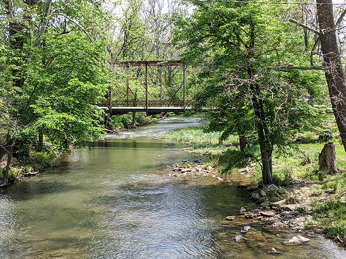 Seven Mile Creek meanders by, carrying stories from 1829 to today in its gentle current.